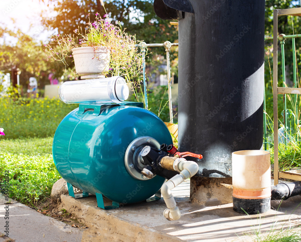Water supply system from a well in a country house. New water filter ...