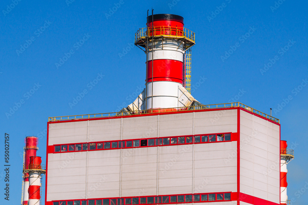 Power plant. Red and white pipe of a thermal power plant. Conversion of ...