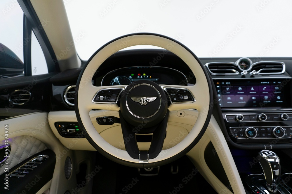 White leather and black piano Steering wheel of a Bentley Bentayga 2022 ...