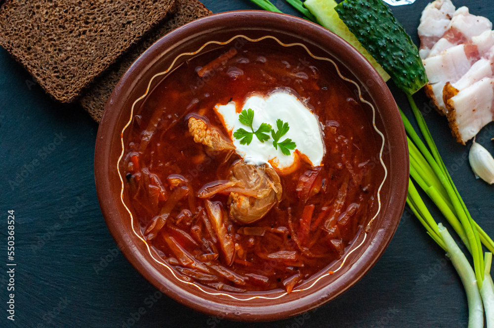 national Ukrainian dish, traditional red borscht with sour cream ...