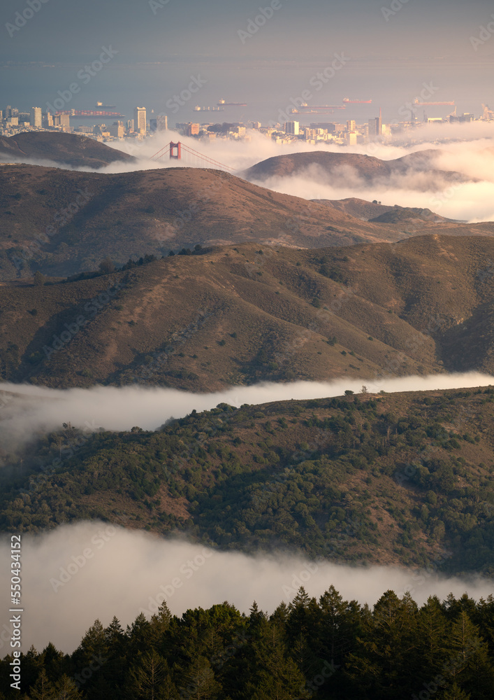 Layers of fog, mountains, and skylines, as viewed from near the top of ...