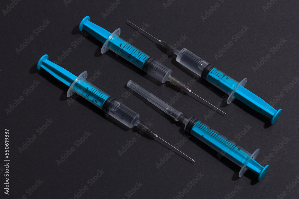 Disposable plastic syringe prepared for injection and vaccination in ...