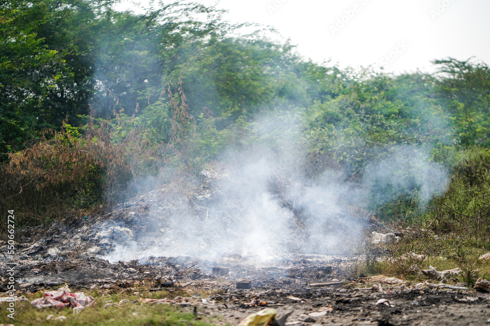 Garbage Dumping and burning site creating air pollution by smoke ...