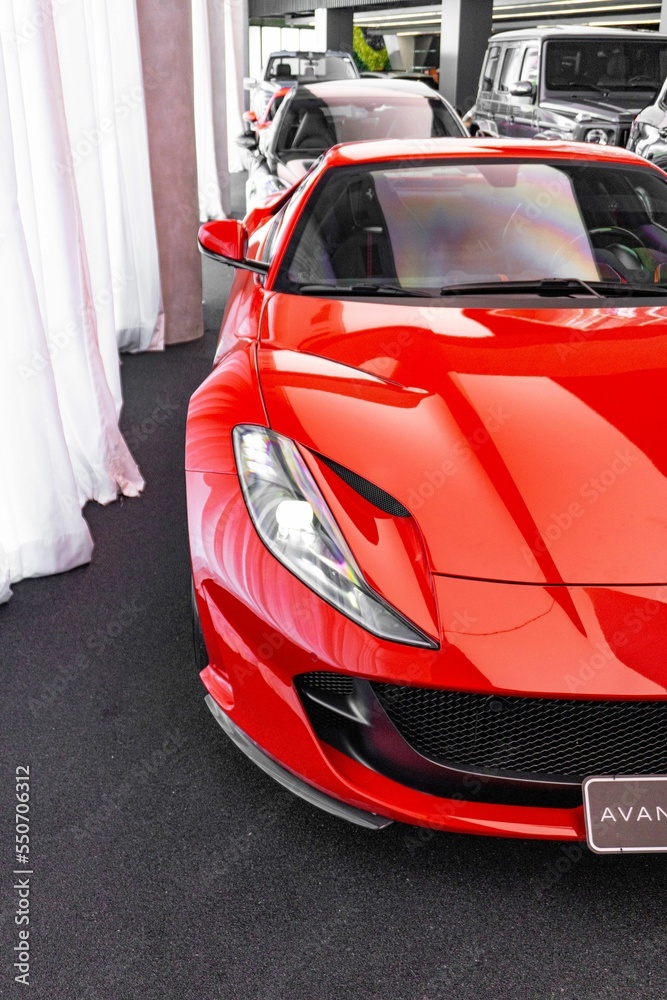 Vertical closeup of Ferrari 812 superfast front view cut in half, in ...