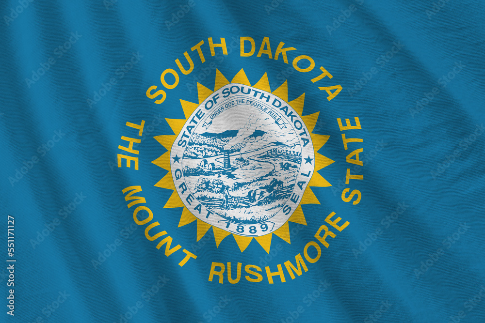 South Dakota US state flag with big folds waving close up under the ...