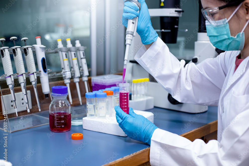 Scientist use micropipette with sample preparation from test tube of ...