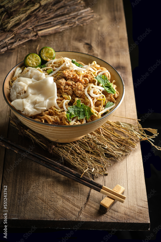 Indonesian traditional food named "bakmi bangka" i.e. flavoured noodle ...