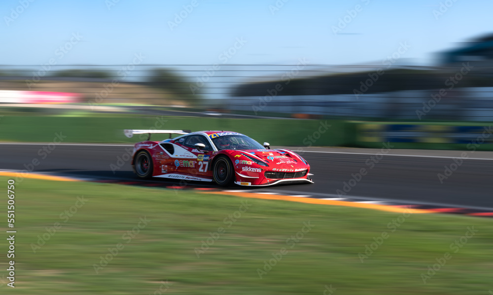 Spectacular scenic racing car on asphalt racetrack Ferrari 488 blurred ...