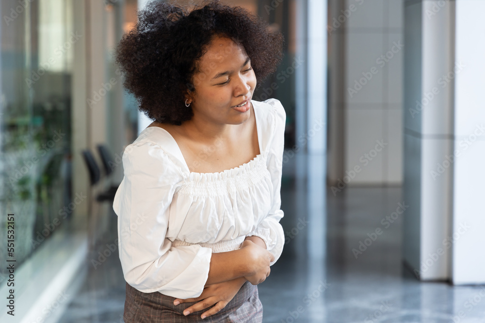 African woman with stomach ache, concept image of menstrual period ...