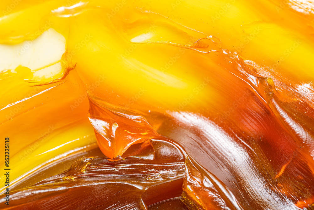 Close up of orange colored industrial grease. Rich and thick texture of ...