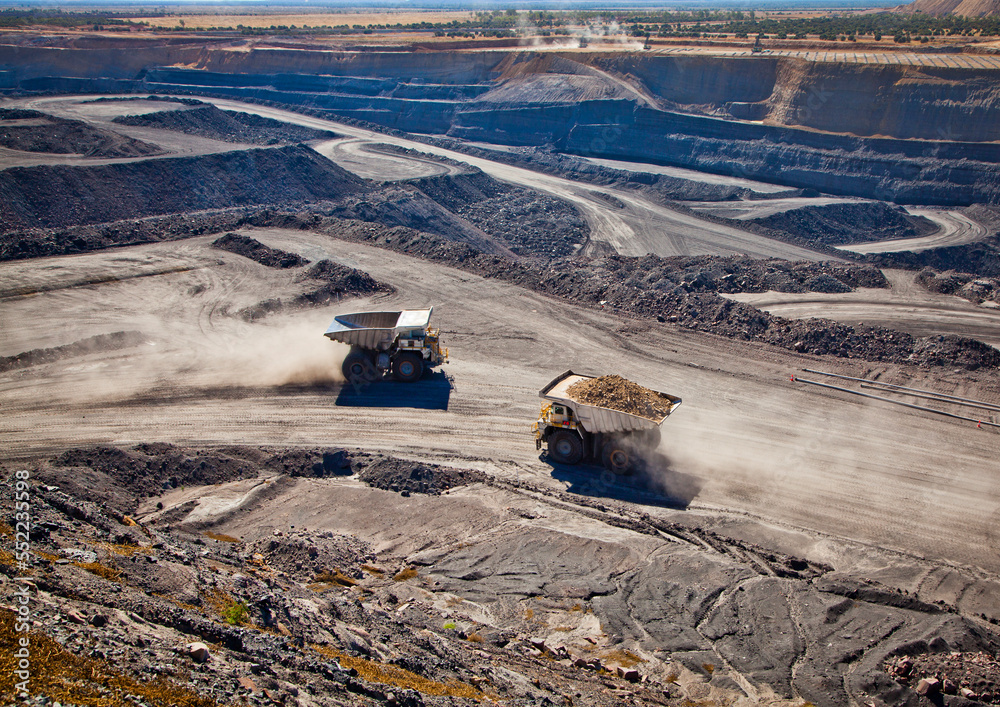 Two diesel-electric trucks used in modern mines and quarries for ...