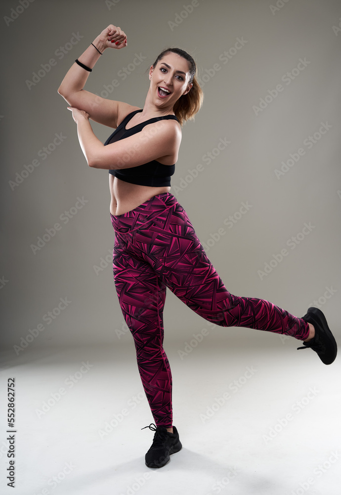 Plus size hispanic woman in fitness attire Stock Photo | Adobe Stock