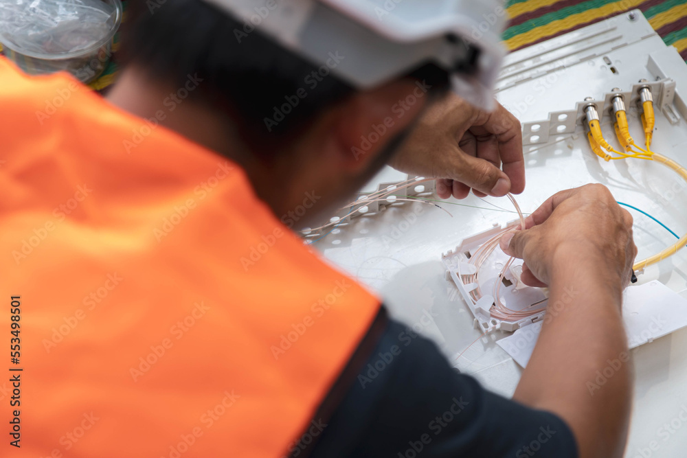 Engineer or technician are install fiber optic cable lines for ...