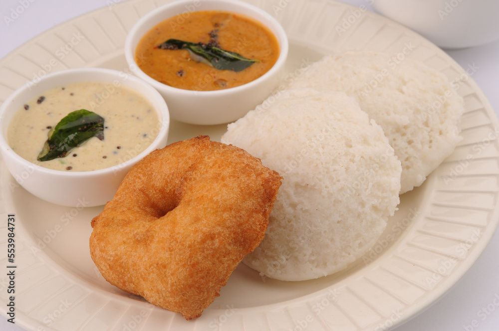Idli, vada, coconut chutney, sambhar, tomato chutney, a south Indian ...