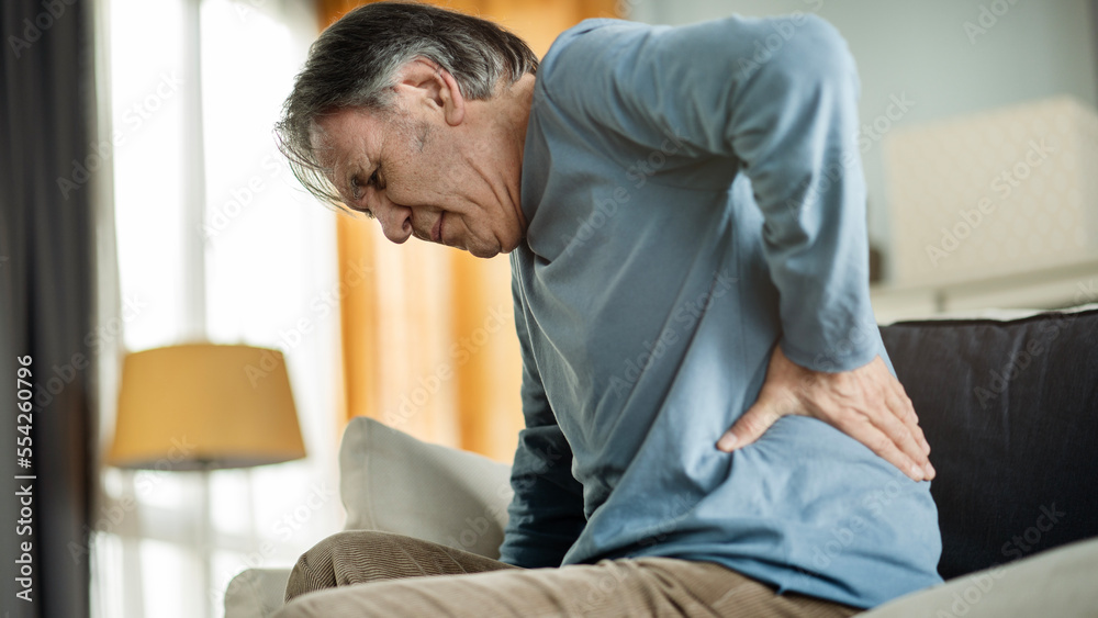 Old man suffering from back pain Stock Photo | Adobe Stock