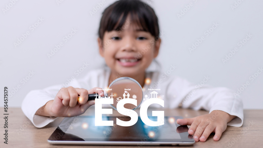 Little girl watching a plant. Environmental technology concept ...