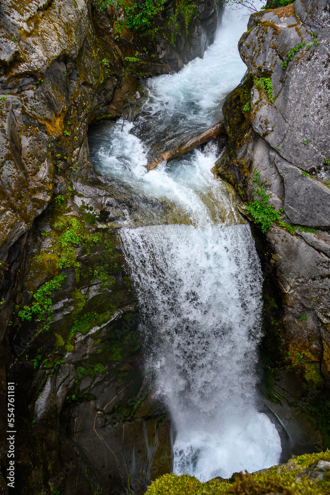 Christine Falls flowing through a rocky cliff face in Mt. Rainier ...