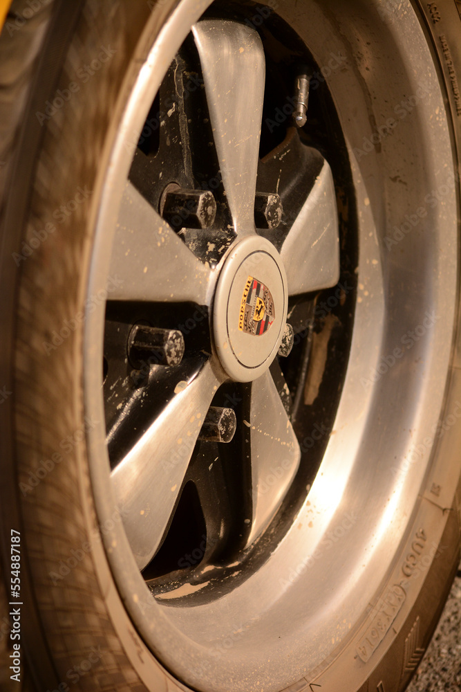 wheel of a porsche car Stock Photo | Adobe Stock