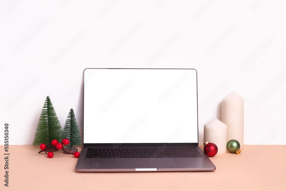 Blank screen on laptop for mock up. Christmas festival setup with gift ...