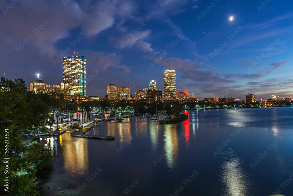 Reflection of building in a river, Charles River and Community Boat ...