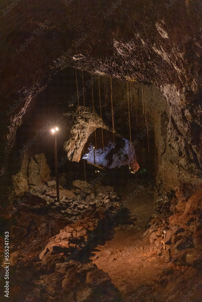 Exploring a volcanic cave in the Volcanic Caves Park at the foot of ...