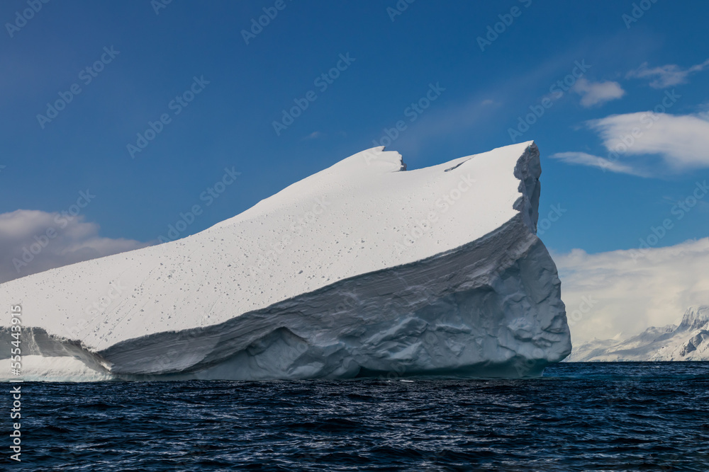 Slanted iceberg just offshsore the Antarctic Peninsula, floating in ...