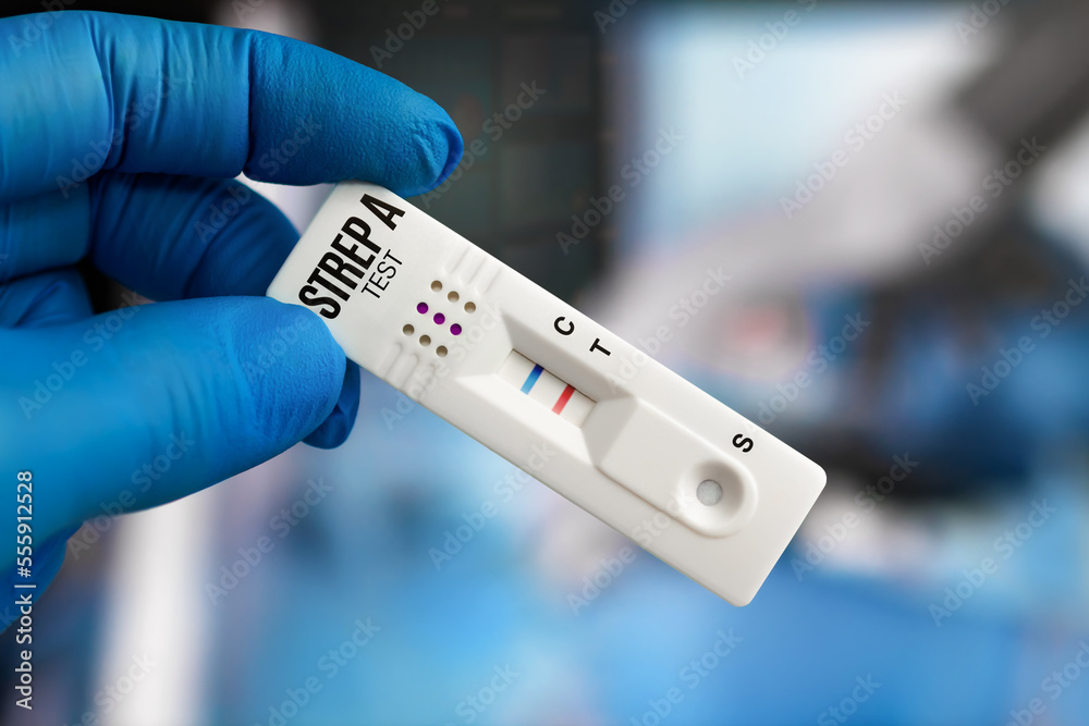 physician with test rapid positive to illness streptococcus group A ...