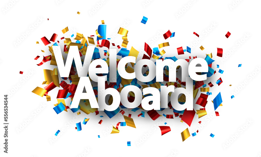 Welcome aboard sign over colorful cut out foil ribbon confetti ...