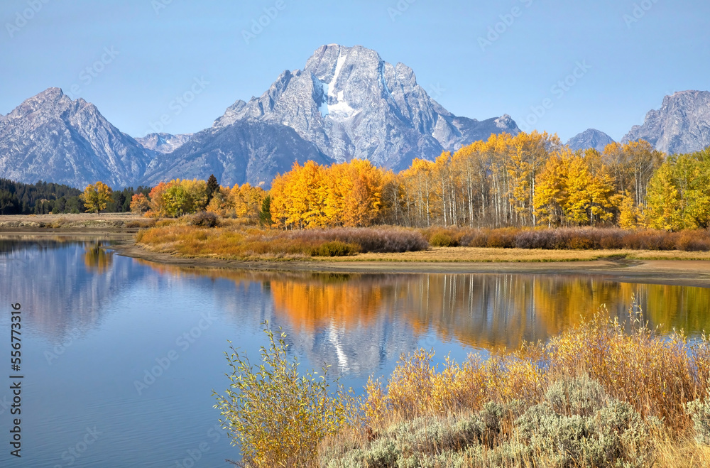The Grand Tetons in Grand Teton National Park reflecting fall colors in ...