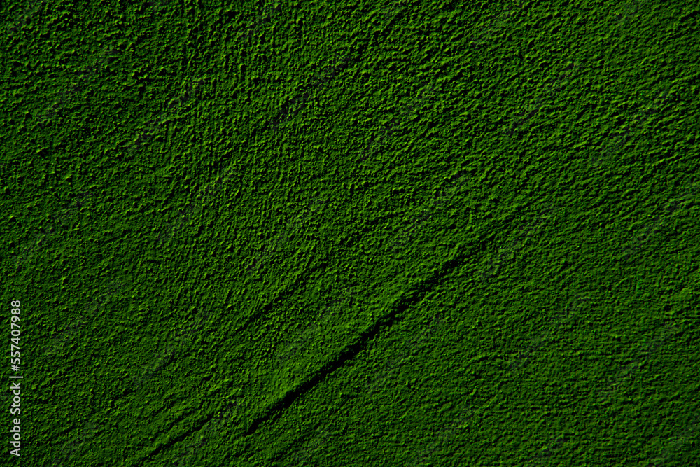 Olive green colored wall background with textures of different shades ...