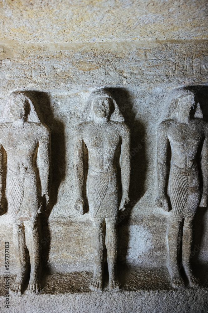 Ancient Egyptian statues in a tomb next the pyramids of Giza in Cairo ...