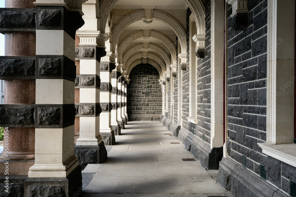 Historic architectural feature of stone arch walkway along exterior of ...