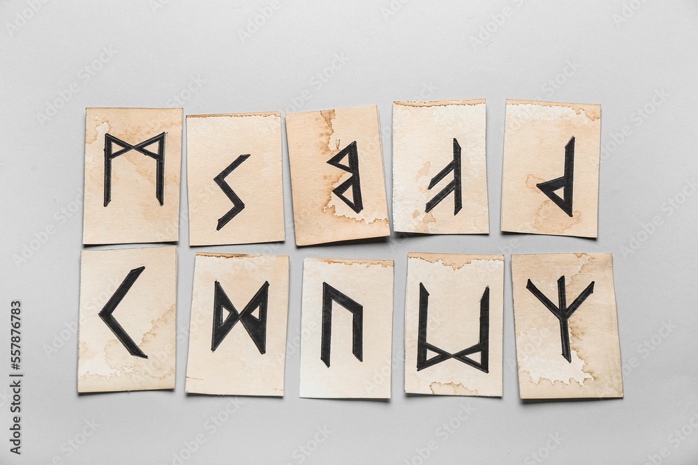 Paper cards with Elder Futhark runes on white background Stock Photo ...