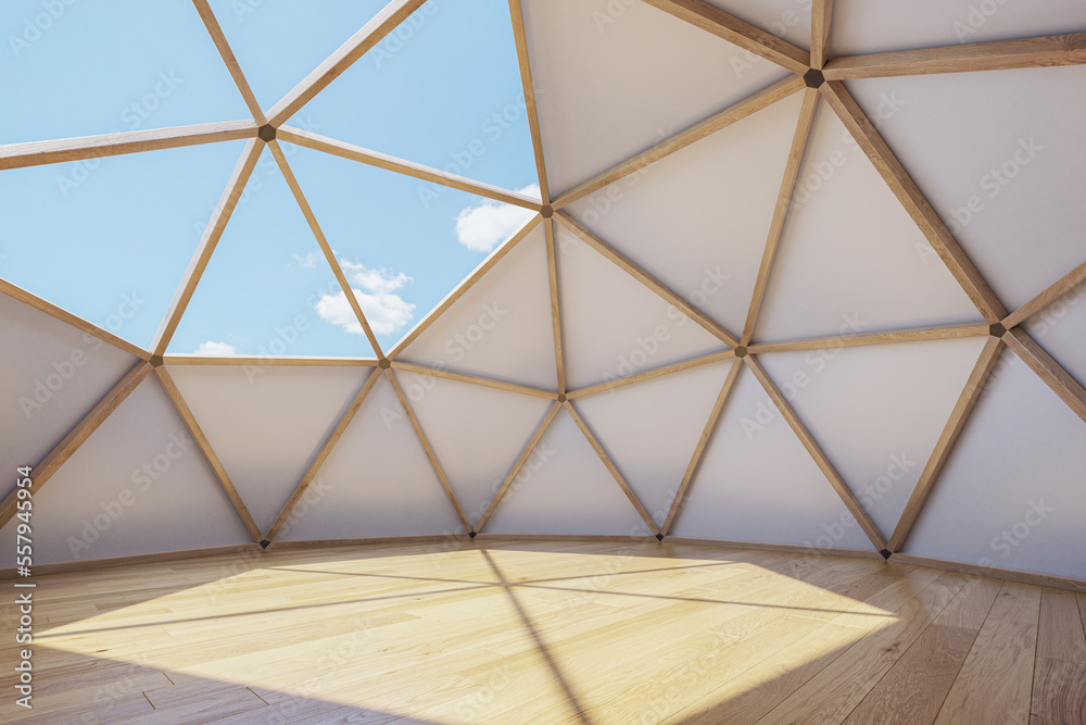 Interior of large geodesic wooden dome tent with window and view to sky ...