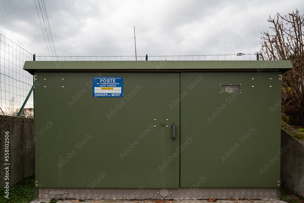 High voltage transformer against the blue sky.Electrical power ...