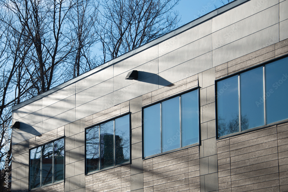 The exterior wall of a contemporary commercial style building with ...