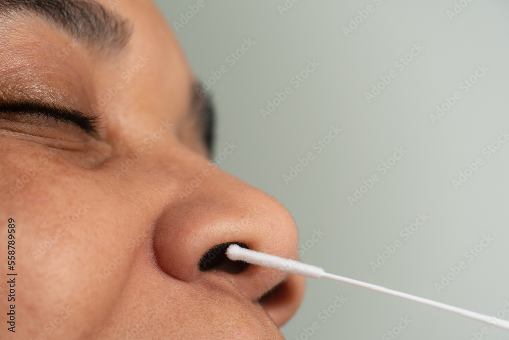 Woman taking a self swabbing home tests for Covid19 with antigen kit ...
