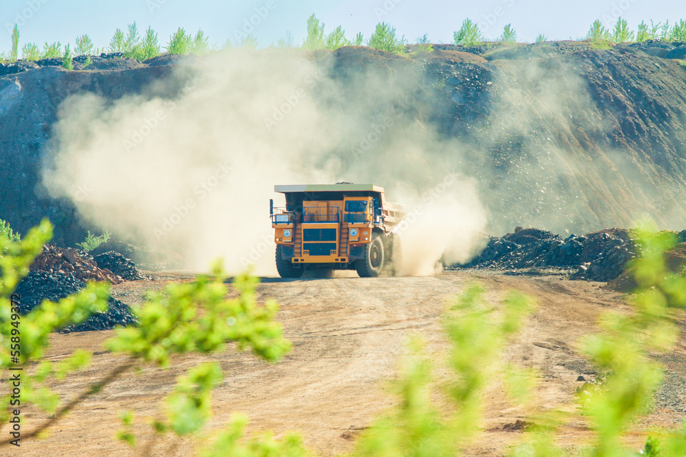Large quarry dump truck to remove the rock mass from the quarry for the ...