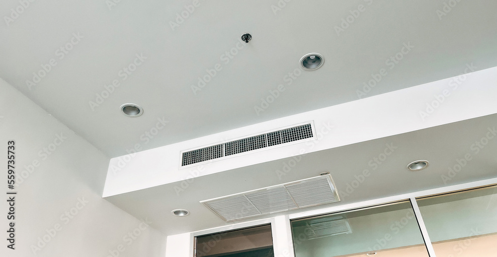 Ceiling mounted cassette type air conditioner and modern lamp light on ...
