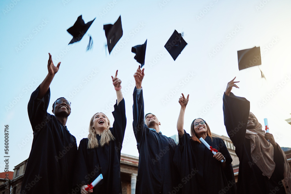 Graduation, education and success with friends in celebration as a ...