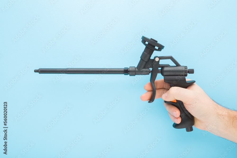 Young adult man hand holding and showing black professional foam spray ...