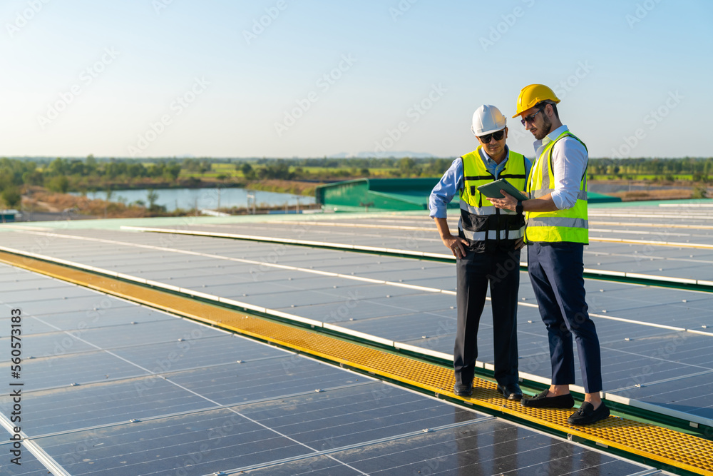 Professional man engineer using digital tablet maintaining solar cell ...