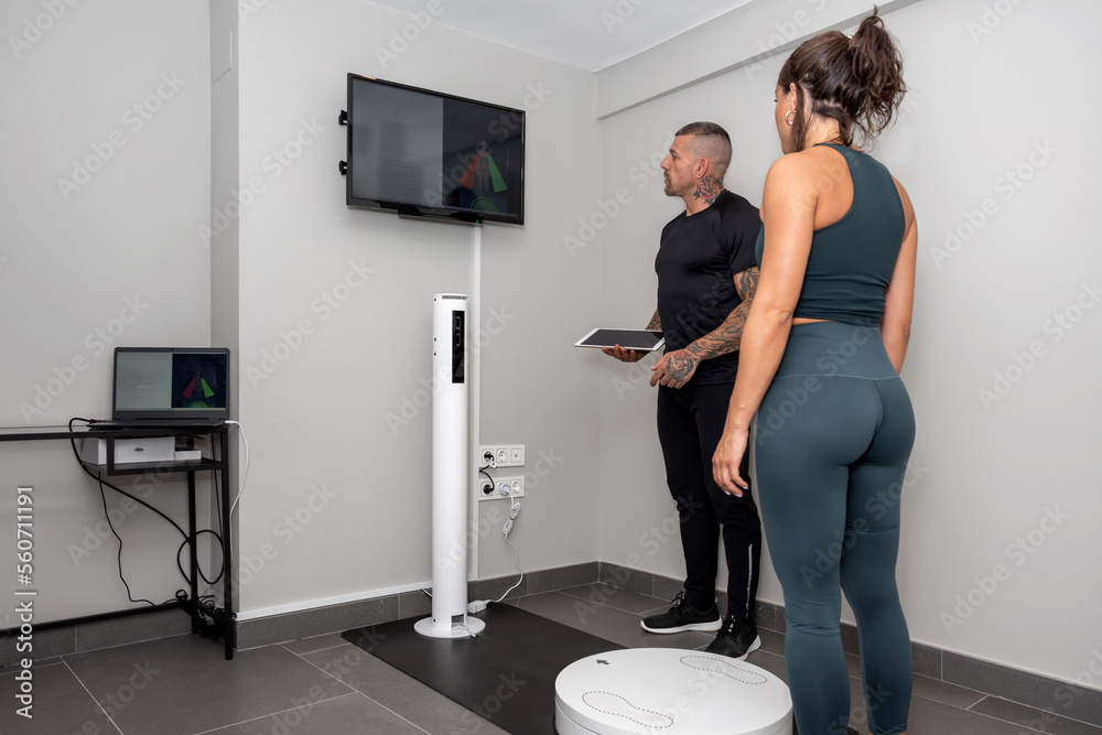 Athletes reading 3D body scanner data Stock Photo | Adobe Stock