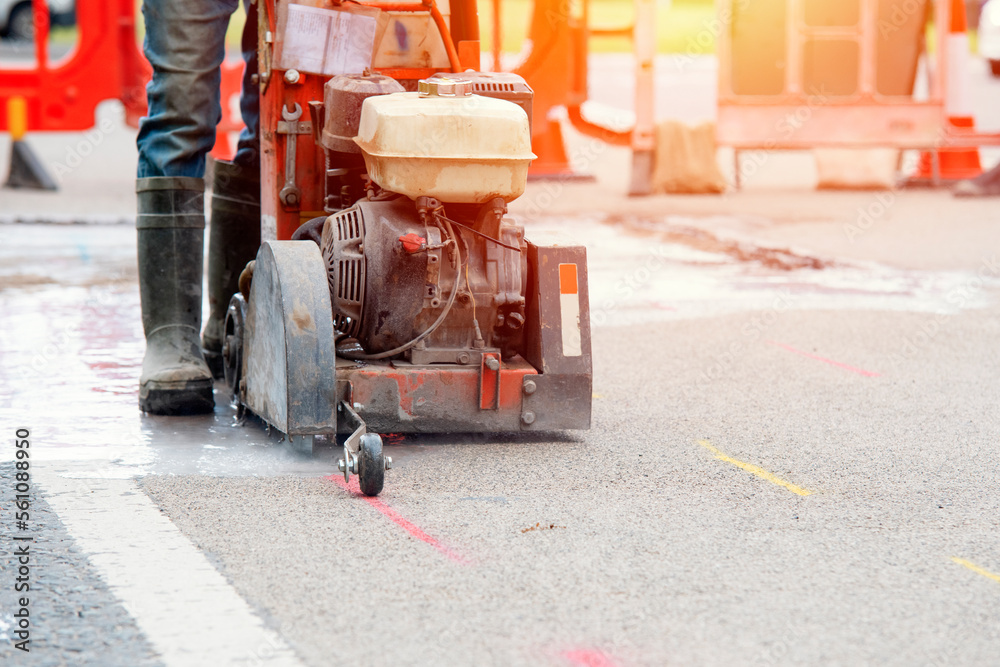 Close up and selective focus of the petrol powered road saw with dimond ...