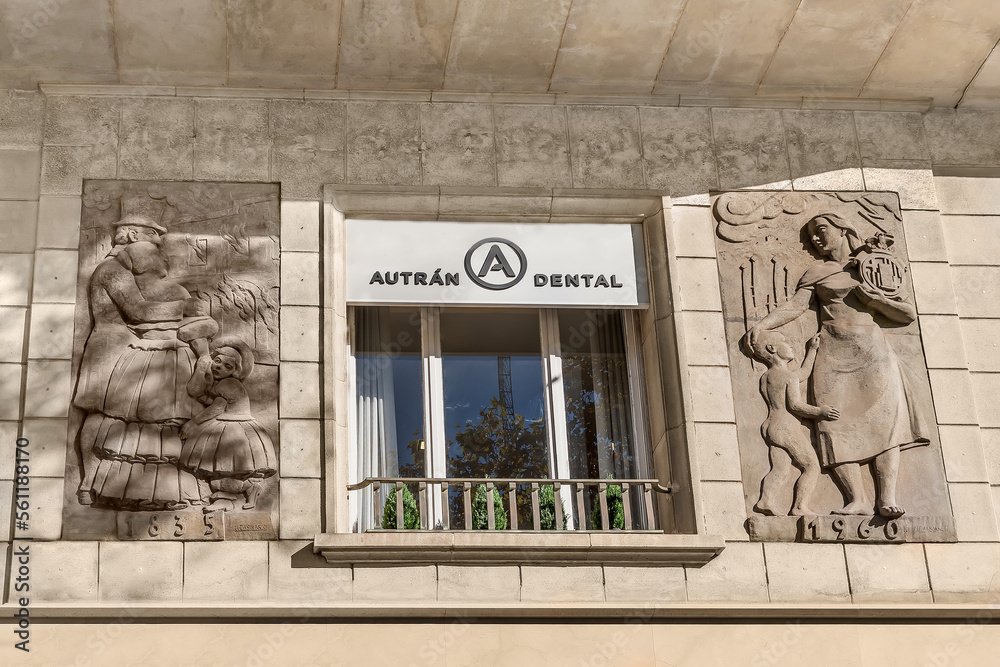 Barcelona, Spain - November 26,2021: Antique bas-reliefs and a modern ...