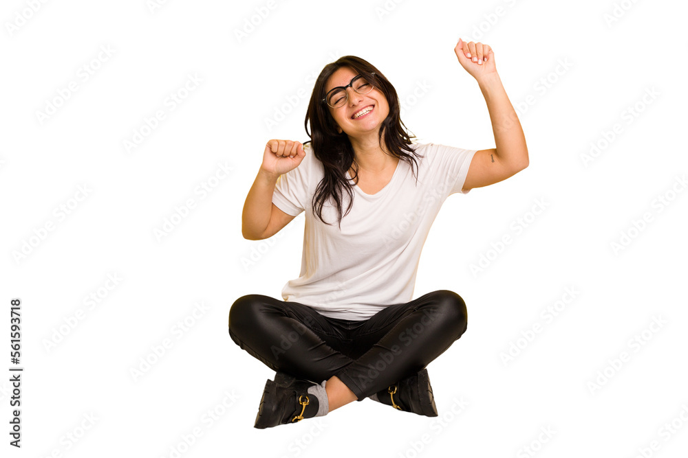 Foto de Stock Young indian woman sitting on the floor cut out isolated ...
