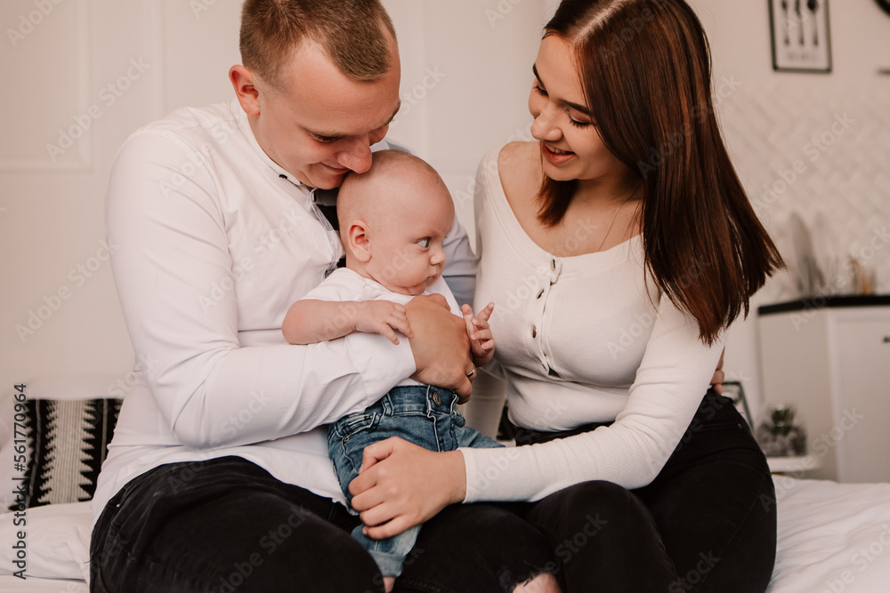 Little boy pop-eyed surprised cute child baby looking at mother breast ...