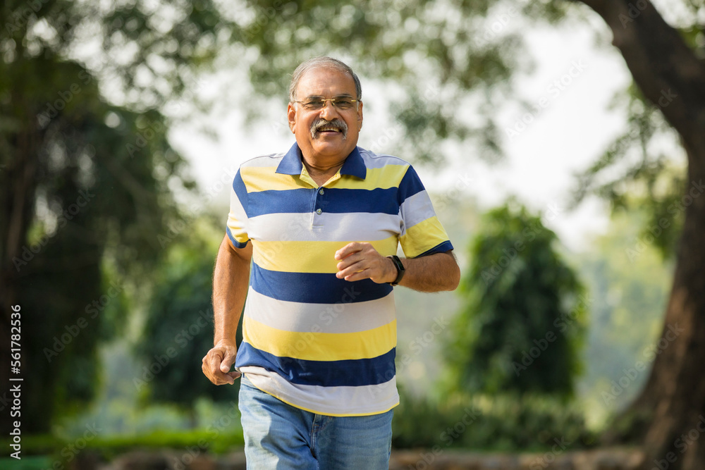 Indian old man running or jogging at park Stock Photo | Adobe Stock
