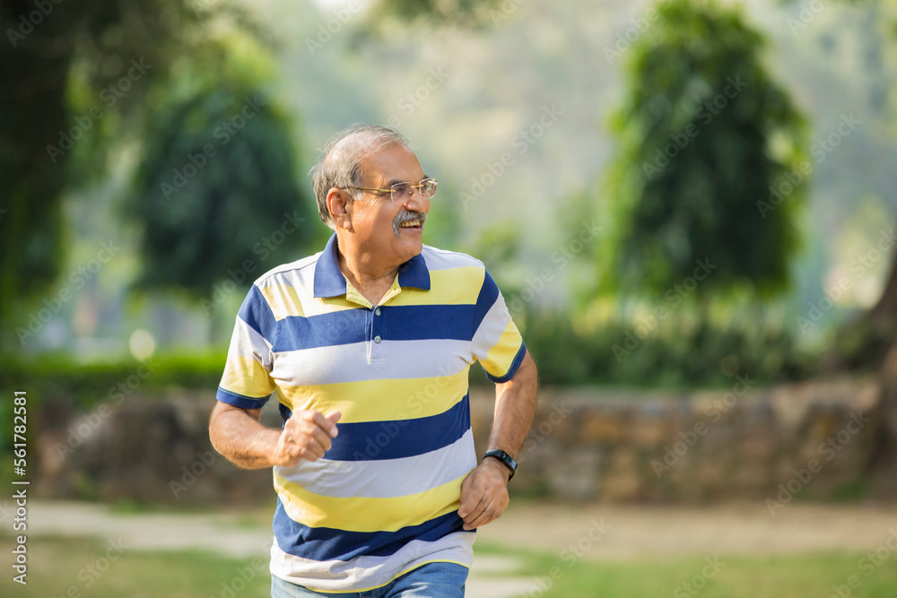 Indian old man running or jogging at park Stock Photo | Adobe Stock