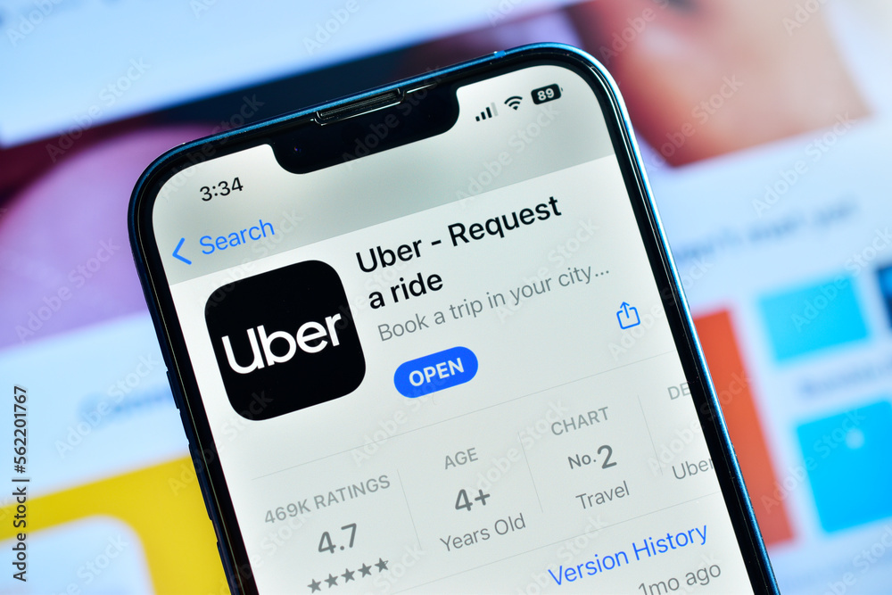 Uber app on smartphone, online taxi booking application Stock Photo ...